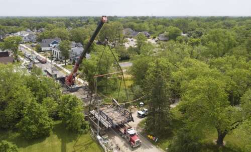 Watch: Crane puts historic Long Grove bridge back in place on way to ...