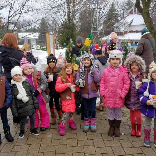 Queen of the Rosary Girl Scouts decorate Christmas tree Cosley Zoo
