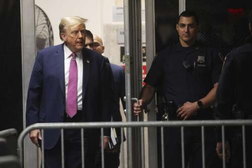 Person rushed away on stretcher after fire extinguished outside Trump ...