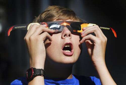 Wear solar specs or make a viewer to safely watch eclipse