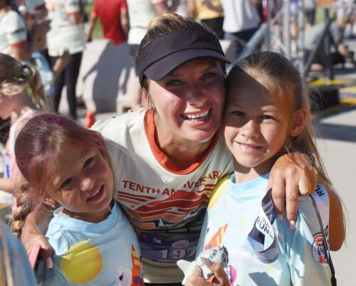 Runners fly to the finish during airport 5K