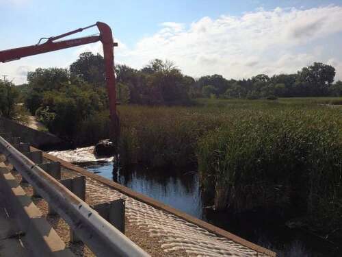 Crews remove floating bog in Fox Lake