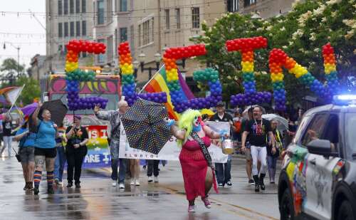 Colorful spirit shines through rain at second annual Elgin Pride Parade ...