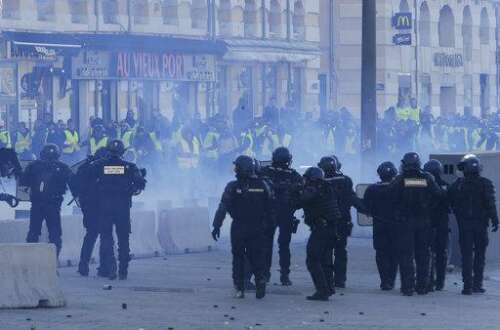 Paris under siege: Tear gas, fury on the Champs-Elysees