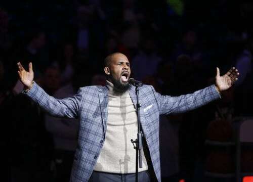R. Kelly stages racy performance amid protest, allegations