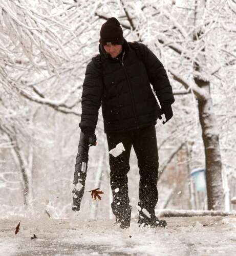 Snow moving out, cold moving in