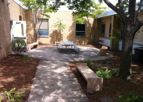 Volunteers transform courtyard at Fairhaven School