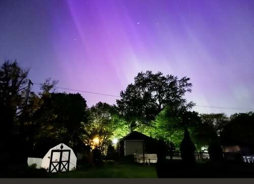 Solar storm creates majestic display of Northern Lights over the suburbs