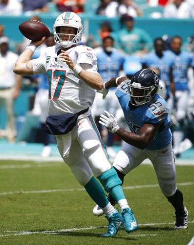 Dolphins overcome 2 lightning delays to beat Titans 27-20