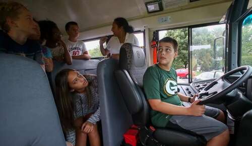 Tech in electric school bus impresses Naperville students