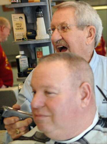 Elgin barber, 80, back at work after 2 strokes