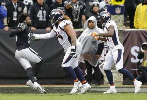 Quarterback carousel turns again for struggling Broncos