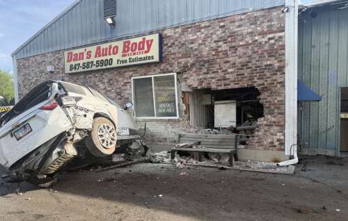 SUV crashes into Fox Lake auto body shop, injuring two