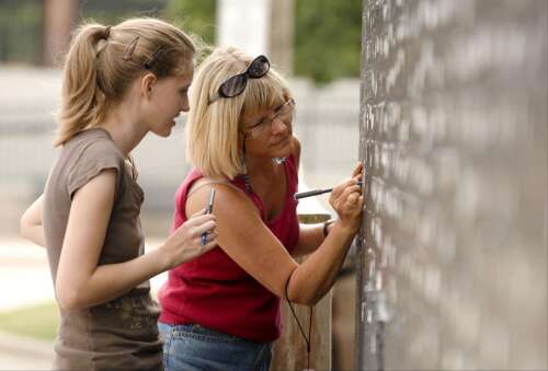 Residents add their names to Wheaton mural