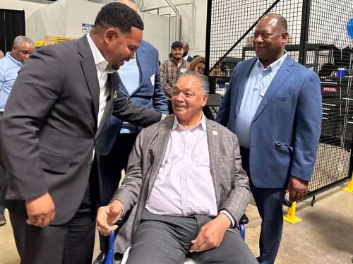 Jesse Jackson helps welcome Kamflex to Aurora