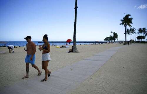 Pandemic-weary Americans plan for summer despite COVID surge