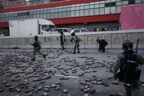 Hong Kong police shoot protester, man set on fire