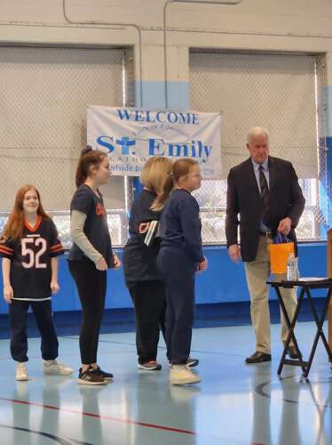 Pat McCaskey talks at St. Emily School