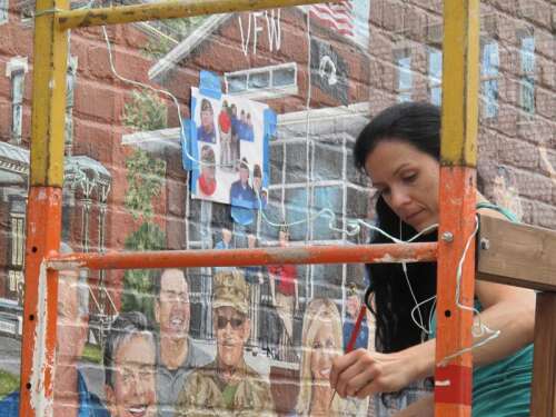 Naperville parade mural shows 'happy people, family values'
