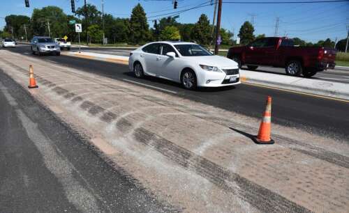 A spray that acts like glue is extending road life and reducing ...