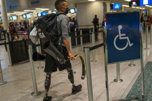 Photographer, his leg lost, seeks answers from Paralympians