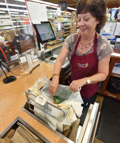 As more suburban bag taxes come online, local chain flips plastic bag ...
