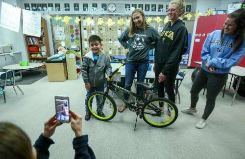 Algonquin boy surprised with new bike for Month of the Military Child