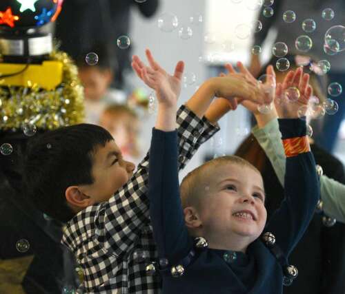Happy Noon Year! Kids celebrate as the clock strikes 12 (p.m.) at ...