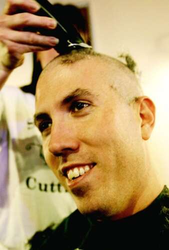 W. Chicago cops shave heads, raise over $13,000 for cancer research