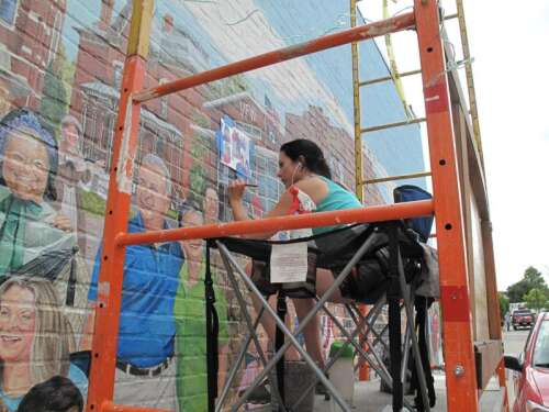 Naperville parade mural shows 'happy people, family values'