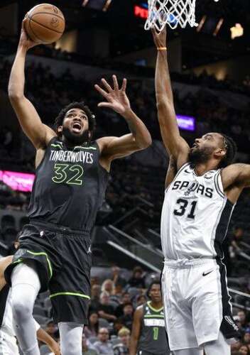 McDermott, Johnson lead Spurs to second victory over Wolves