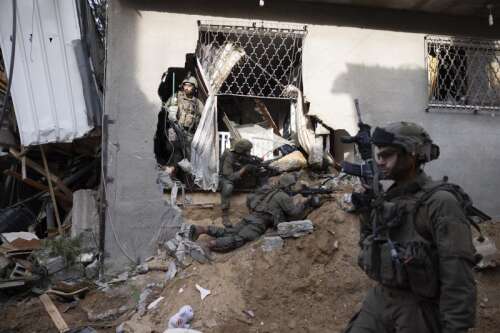 Israel battles militants in Gaza's main cities, with civilians trapped ...