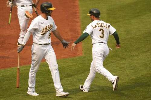 Pinder delivers timely hit, A's advance in playoffs at last
