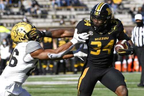 Missouri takes on ex-coach Odom, Arkansas in rivalry game
